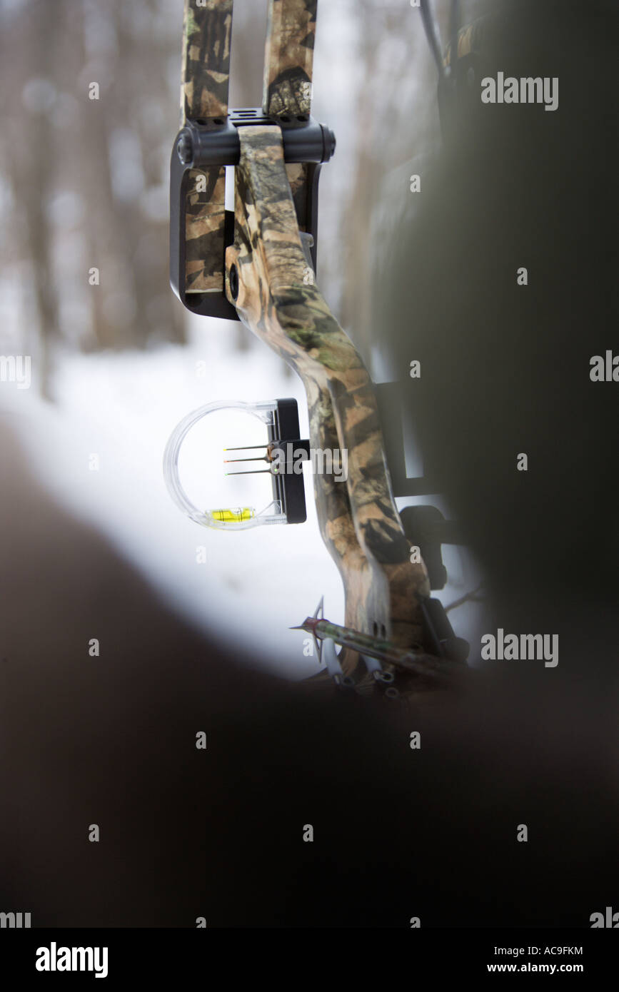 Camouflage bow and arrow with blurred foreground Stock Photo - Alamy