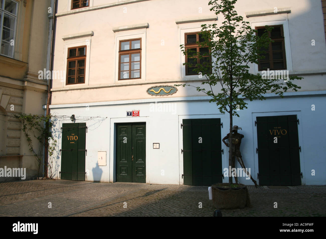 Closed cafe in Prague in the morning with green doors and windows ...