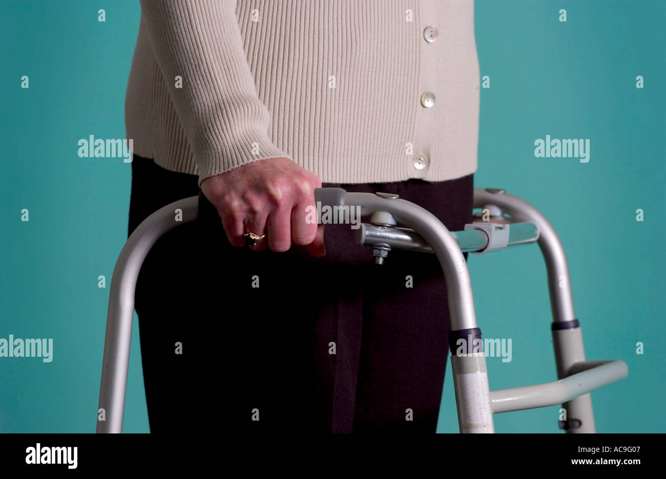 Senior woman walking with walker Stock Photo - Alamy