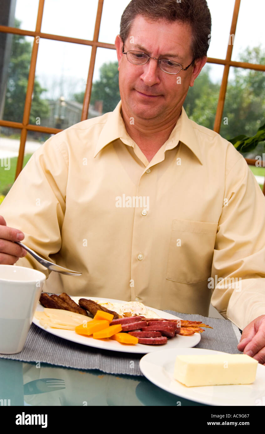 Man eating breakfast Stock Photo - Alamy