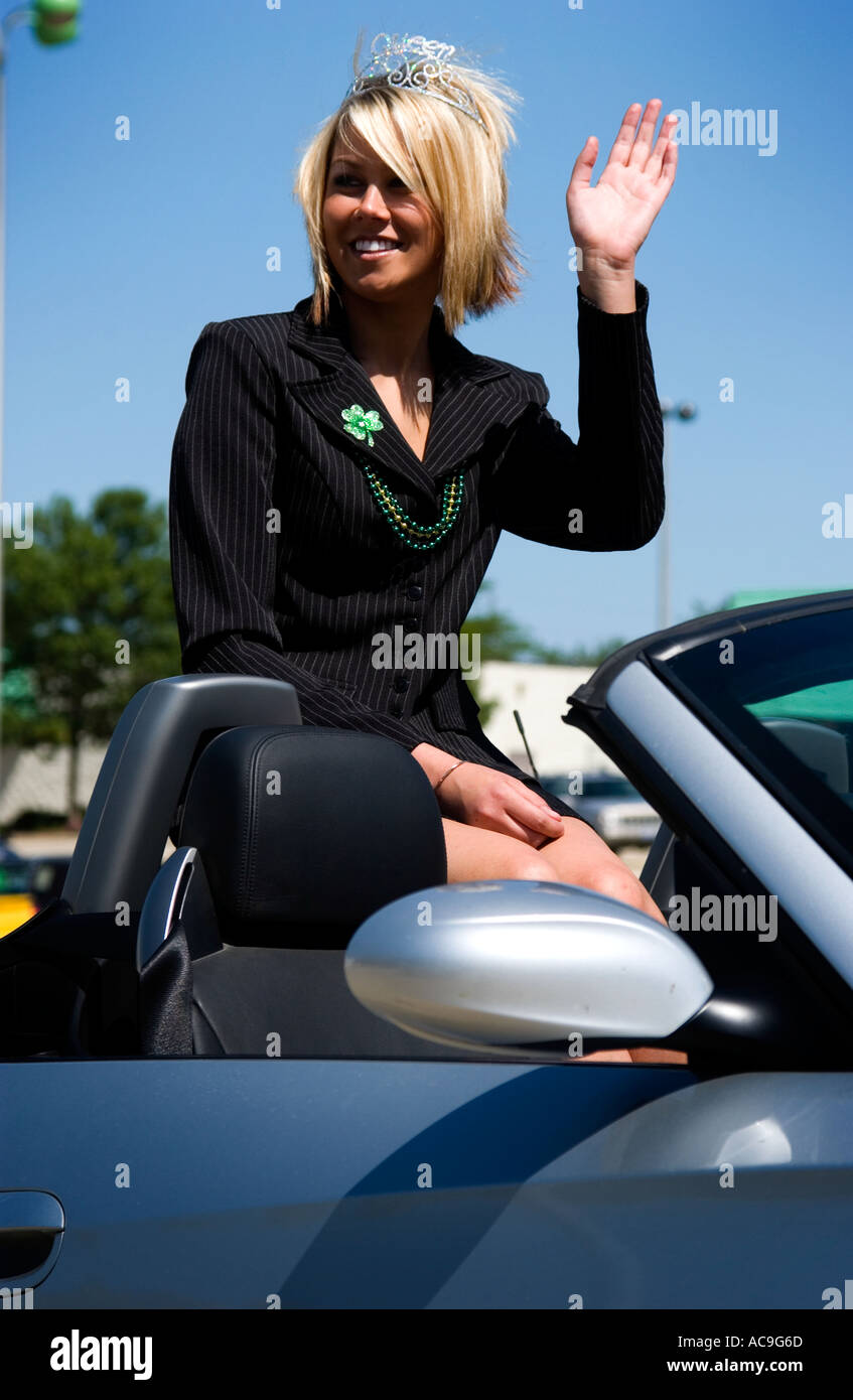 Woman waving in parade Stock Photo - Alamy