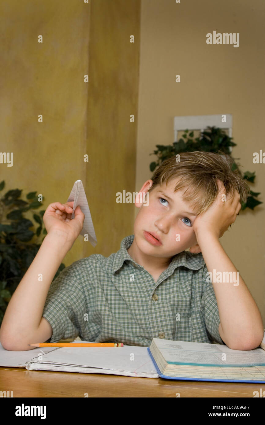 Boy doing homework Stock Photo - Alamy