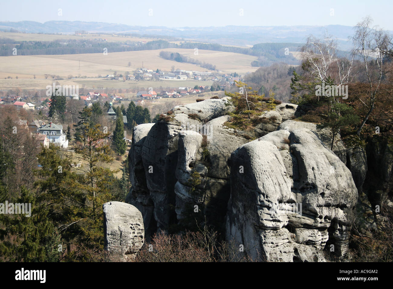 Scenic view of rock formations and village landscape in Český ráj ...