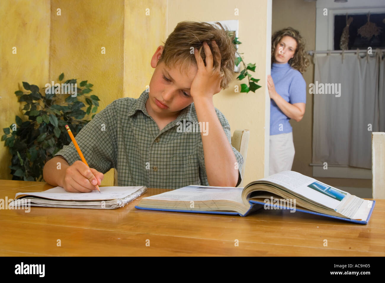 Boy doing homework Stock Photo - Alamy