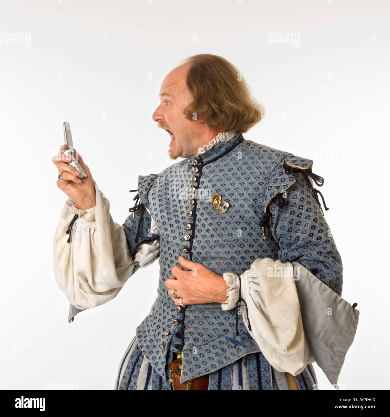 William Shakespeare in period clothing screaming at cell phone Stock ...
