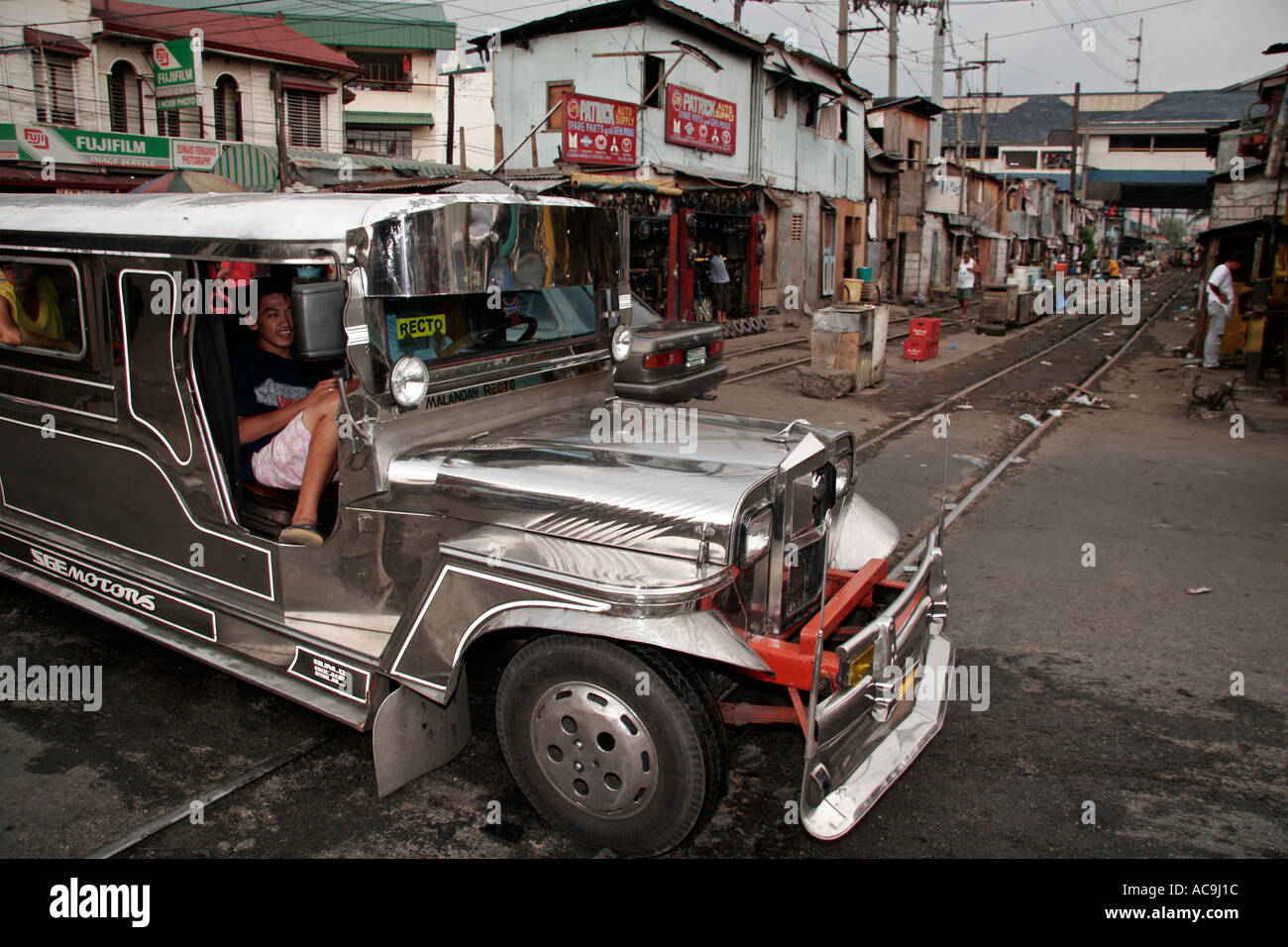 Jeepney crossing railway tracks in hi-res stock photography and images ...