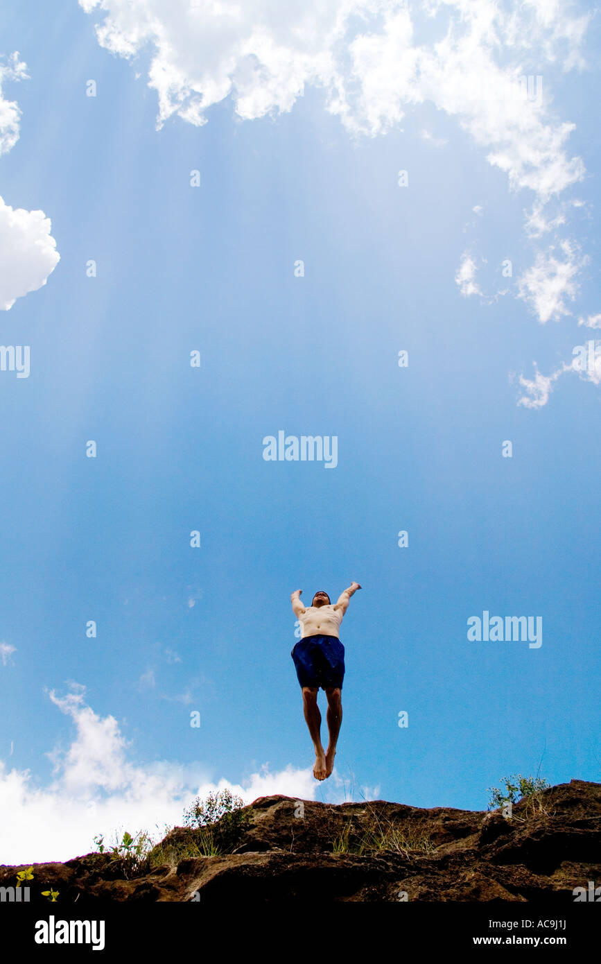 Man Diving from Cliff Stock Photo - Alamy