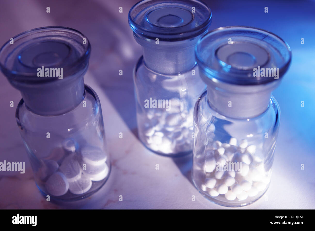 Homeopathic pills in glass bottles Stock Photo - Alamy