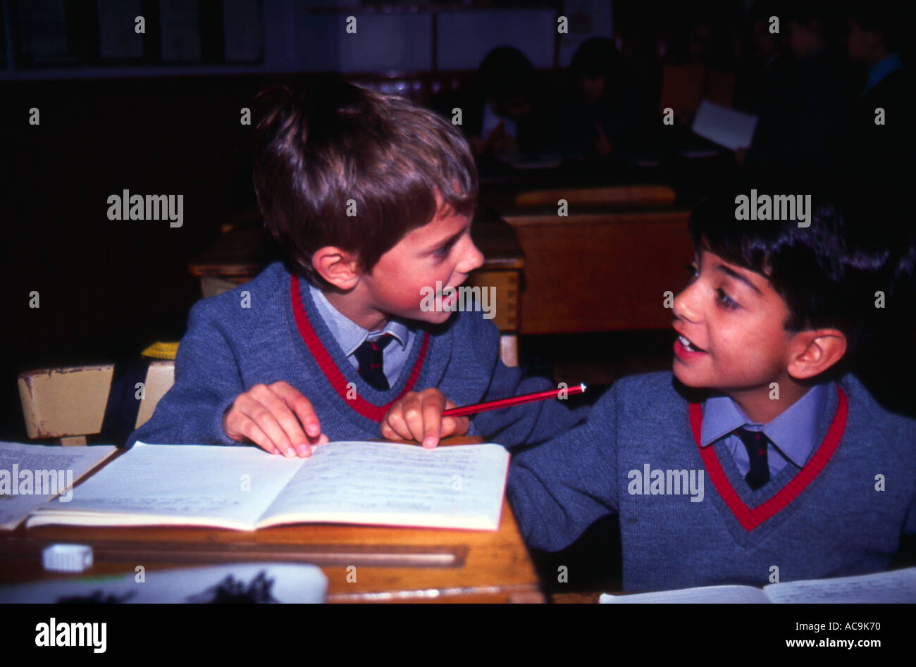 Two school boys talking Stock Photo - Alamy