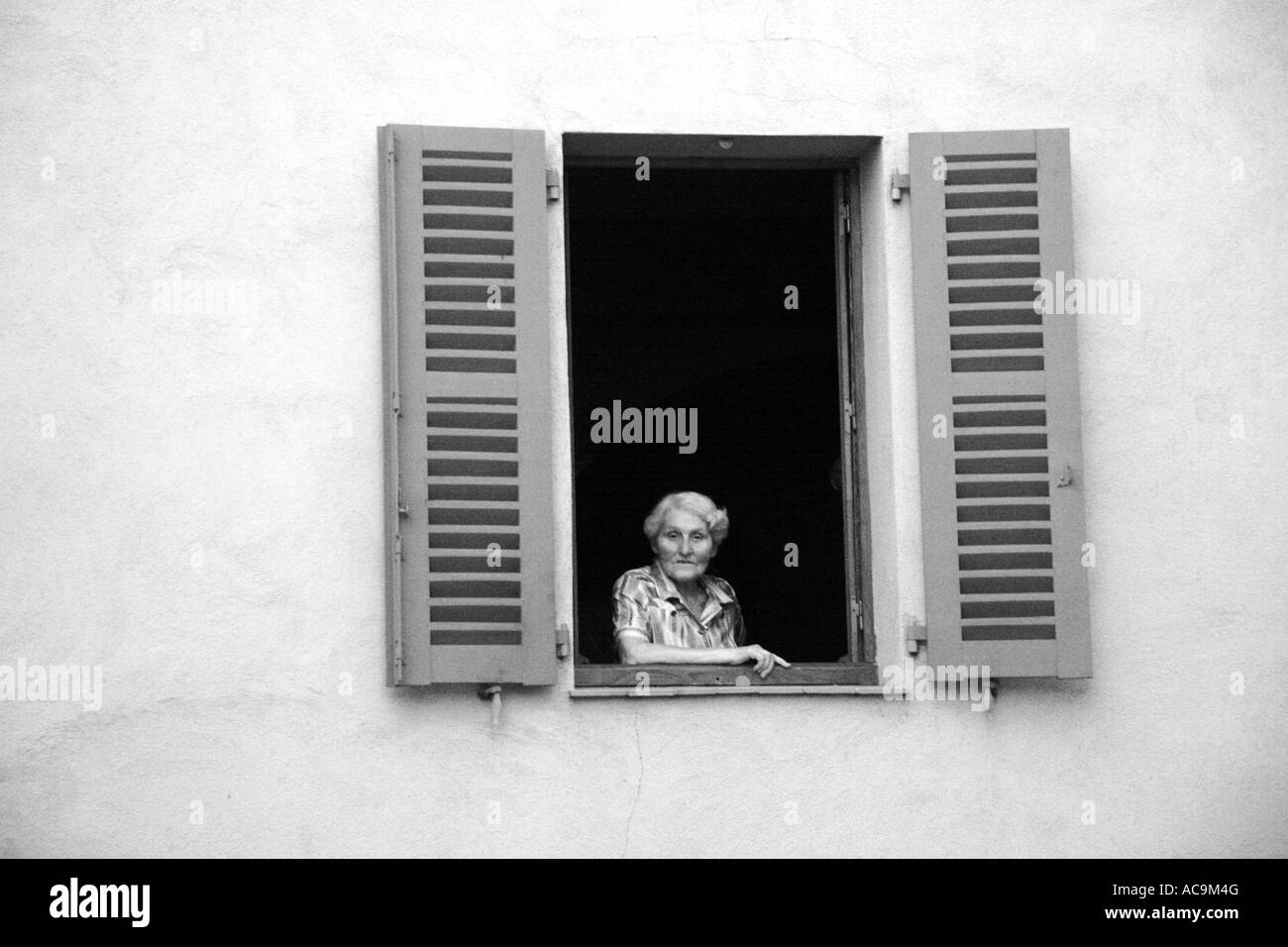 Old woman by the window Black and White Stock Photos & Images - Alamy