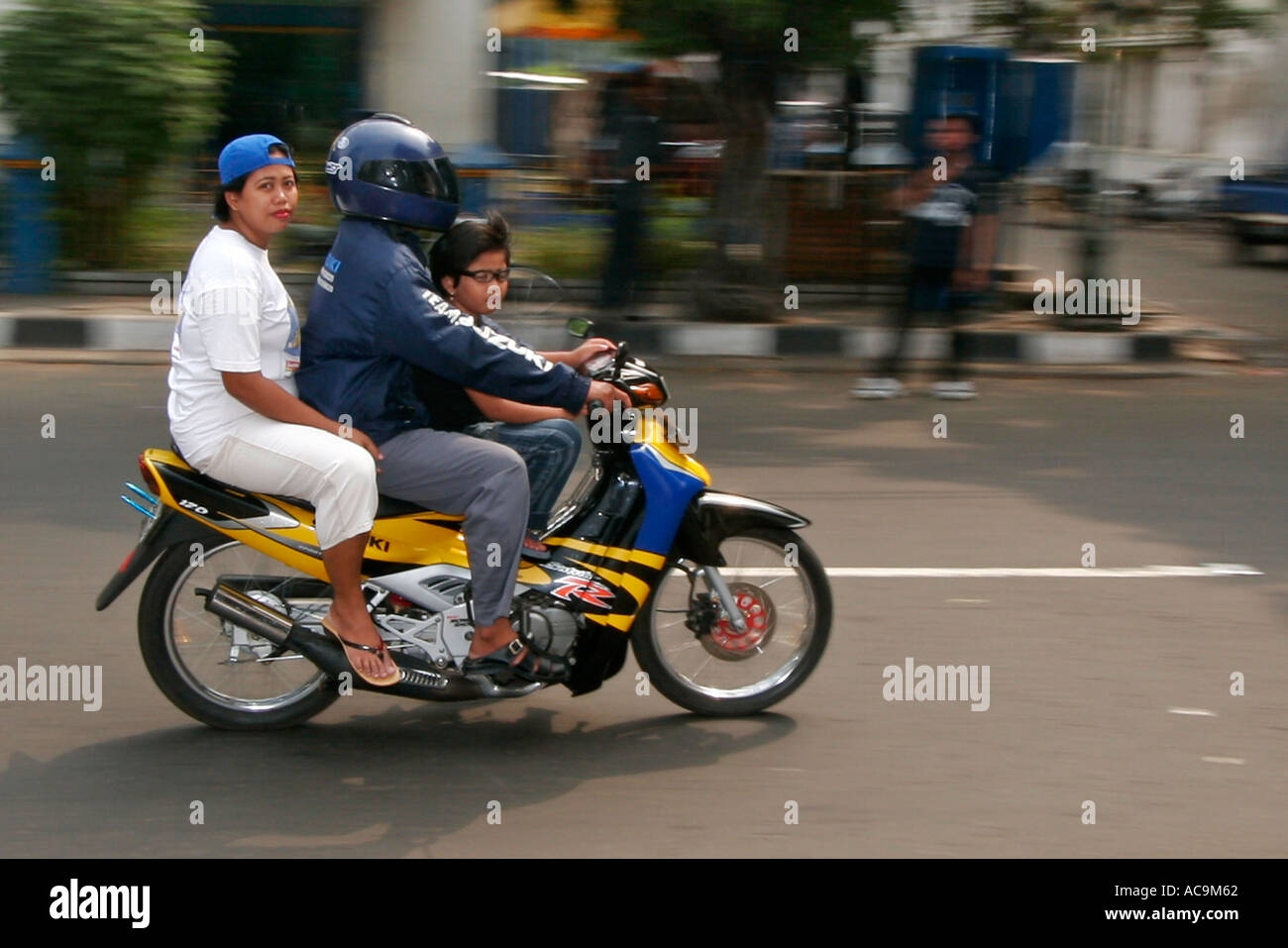 Three on a motorcycle Jakarta Indonesia Stock Photo - Alamy