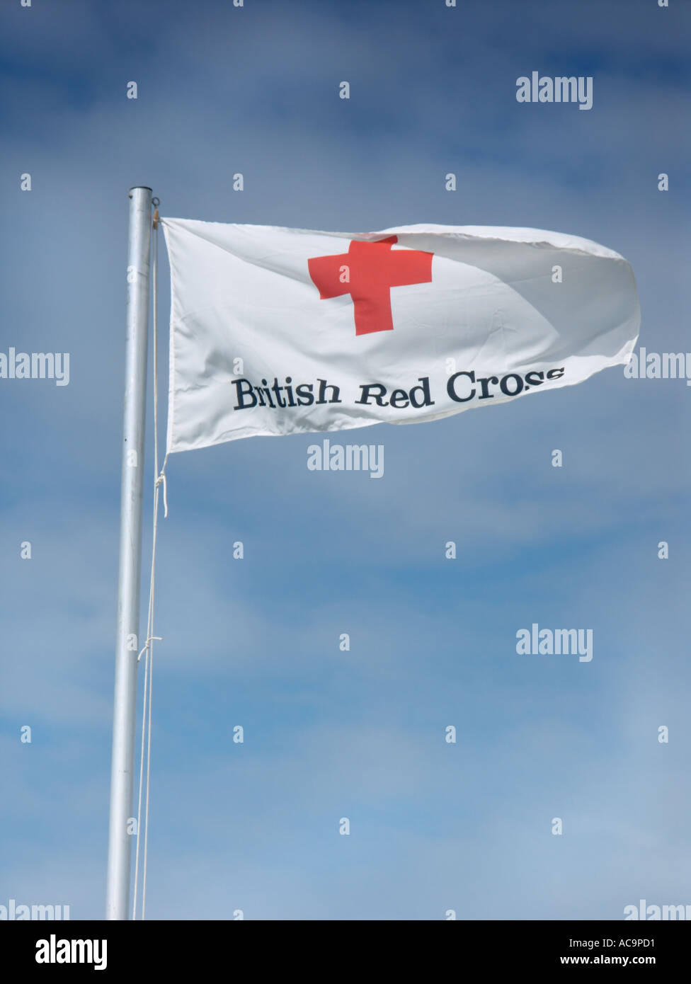 British Red Cross flag flying against a summery blue sky Stock Photo ...