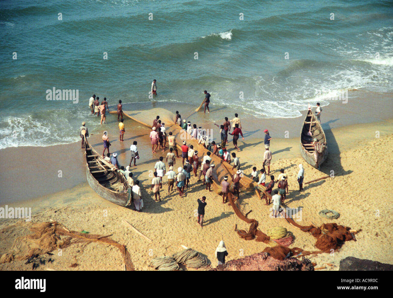 Netting fish at Varkala Kerala India IN22 29 Stock Photo - Alamy