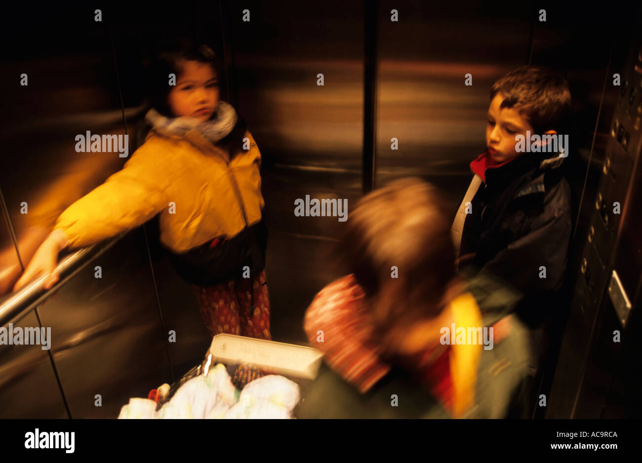Three Young Children Inside A Lift Stock Photo - Alamy