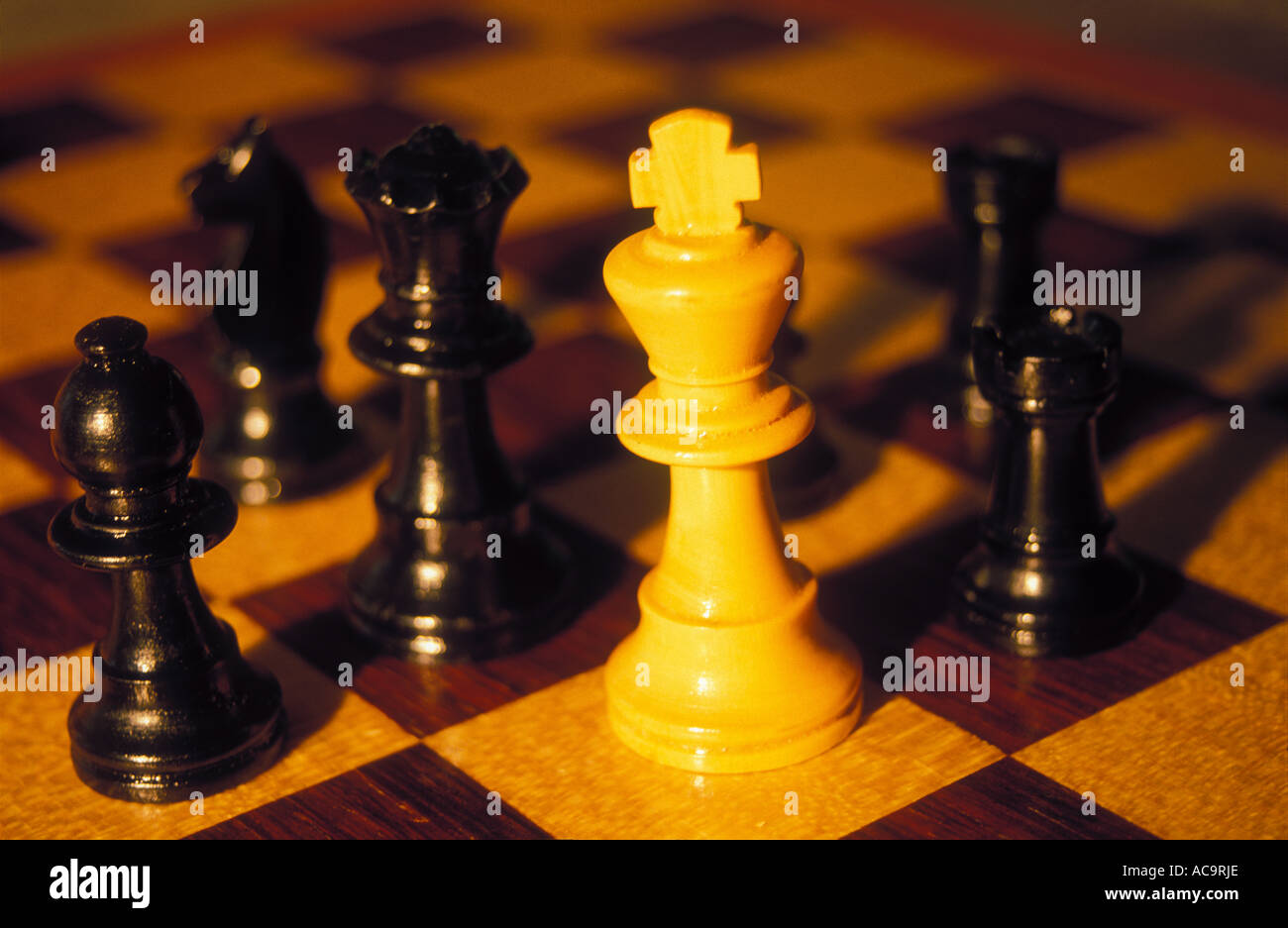 Chess pieces - king surrounded! Stock Photo - Alamy