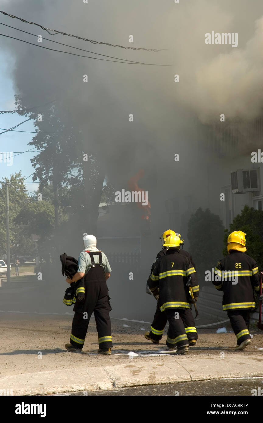 Firefighters at work Stock Photo - Alamy