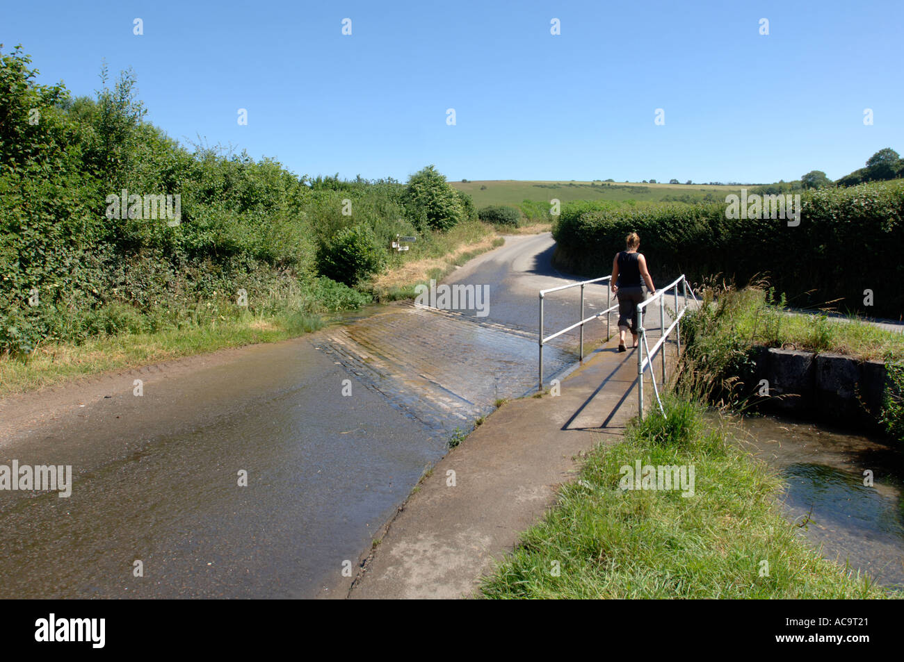 A ford river crossing over a road in the Piddlevalley in Dorset Stock ...