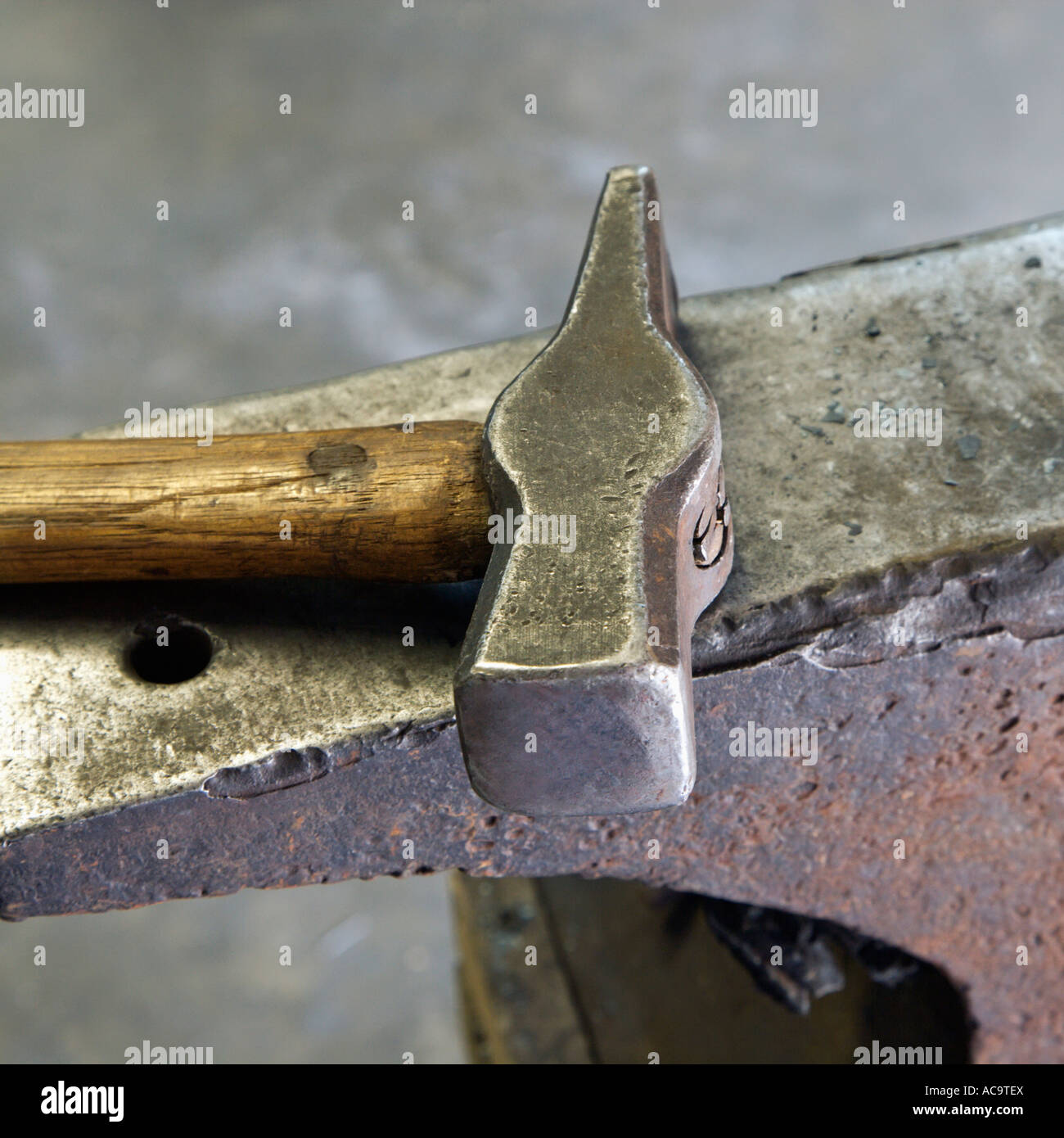 Still life shot of hammer laying on anvil Stock Photo - Alamy
