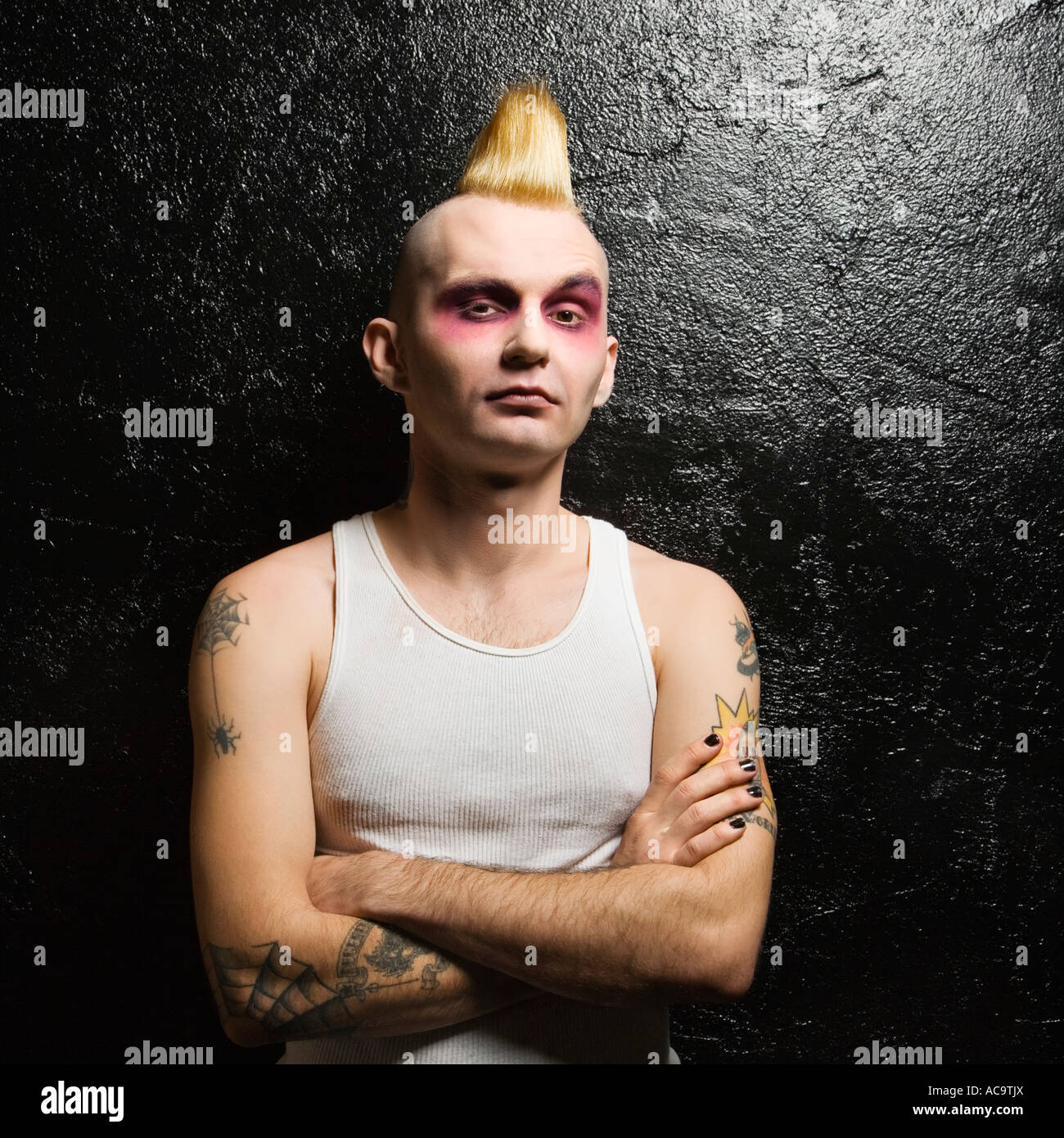 Portrait of mid adult Caucasian male punk with his arms crossed Stock ...