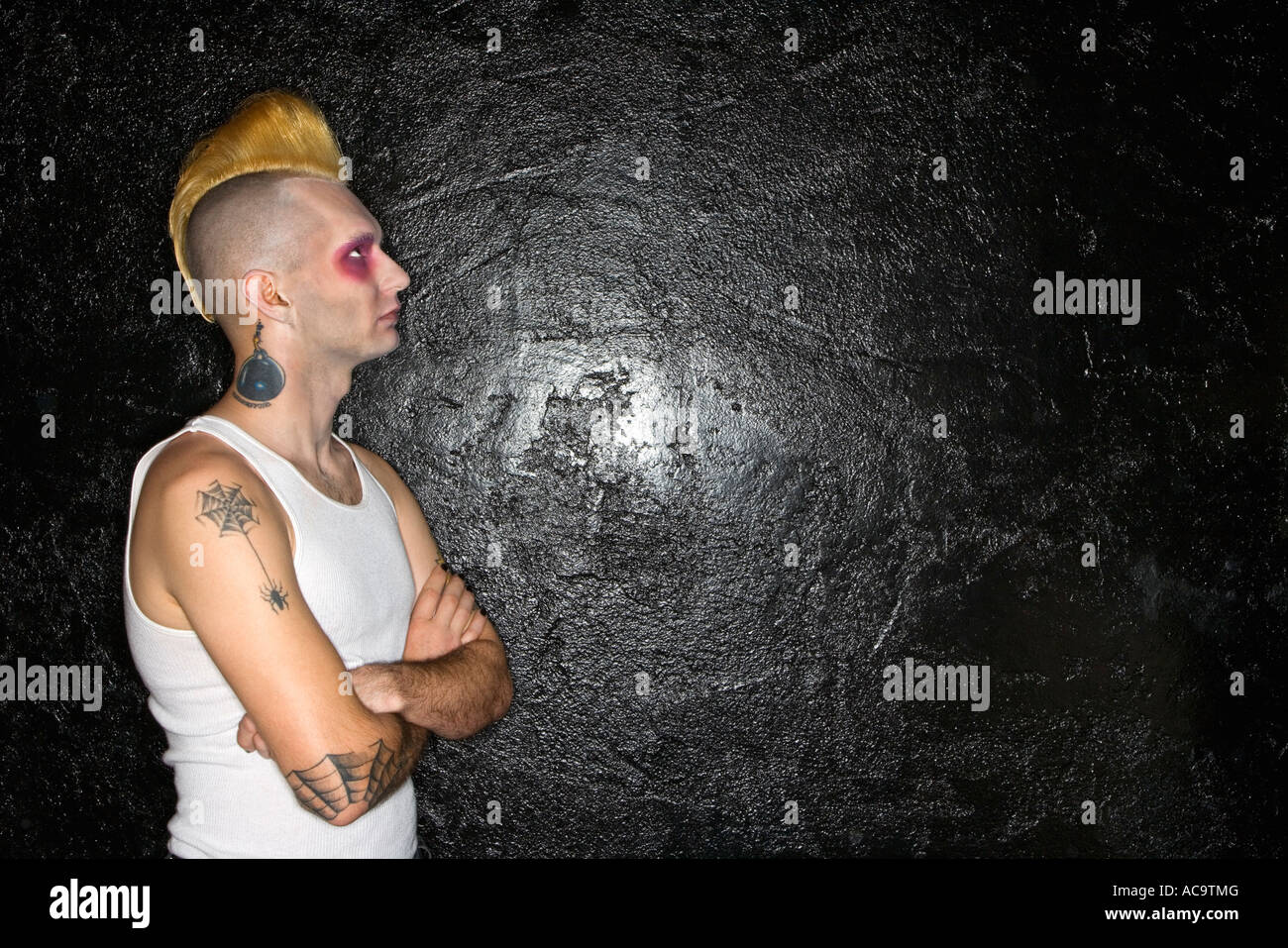 Profile shot of mid adult Caucasian male punk Stock Photo - Alamy