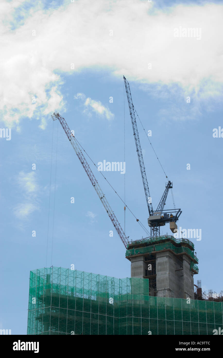 crane on top of building under construction Stock Photo - Alamy