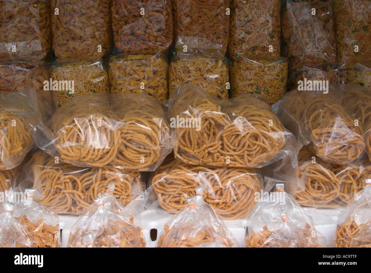 packets of indian crunchy snacks on sale Stock Photo - Alamy