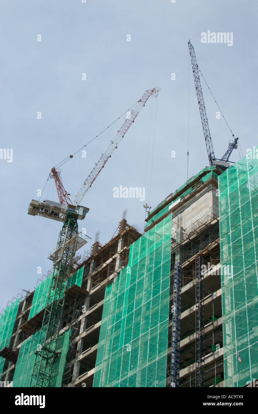 crane on top of building under construction Stock Photo - Alamy