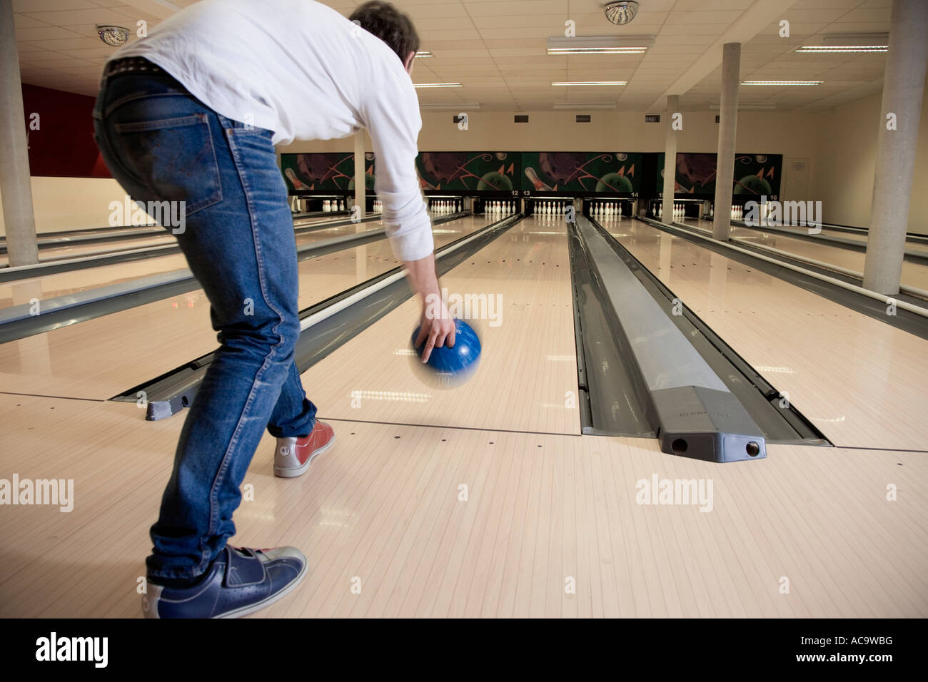 Man bowling at a bowling centre Stock Photo - Alamy
