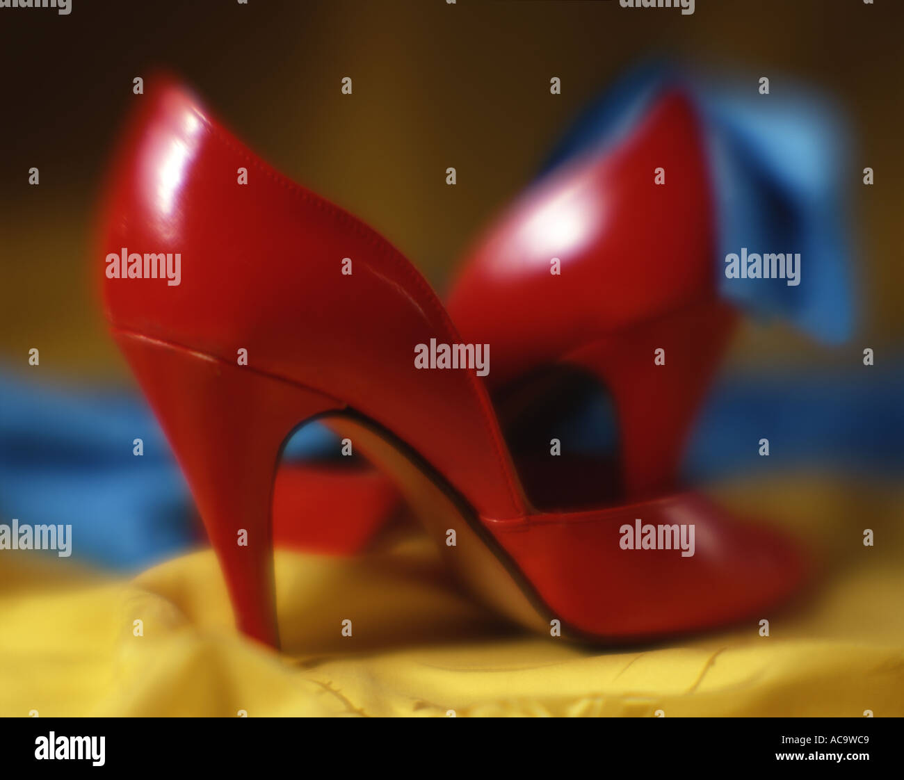 Red high heel shoes with yellow and blue cloth Stock Photo - Alamy