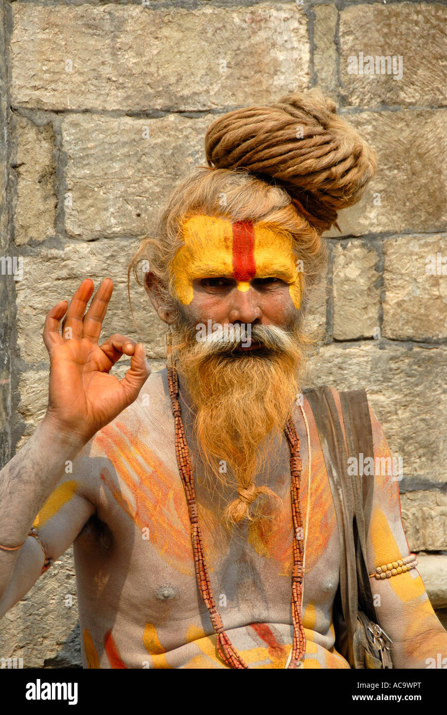Holy man sadhu blesses colourfully painted Pashupatinath Kathmandu ...