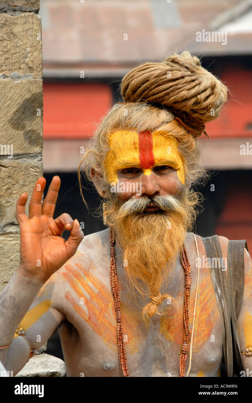 Holy man sadhu blesses colourfully painted Pashupatinath Kathmandu ...
