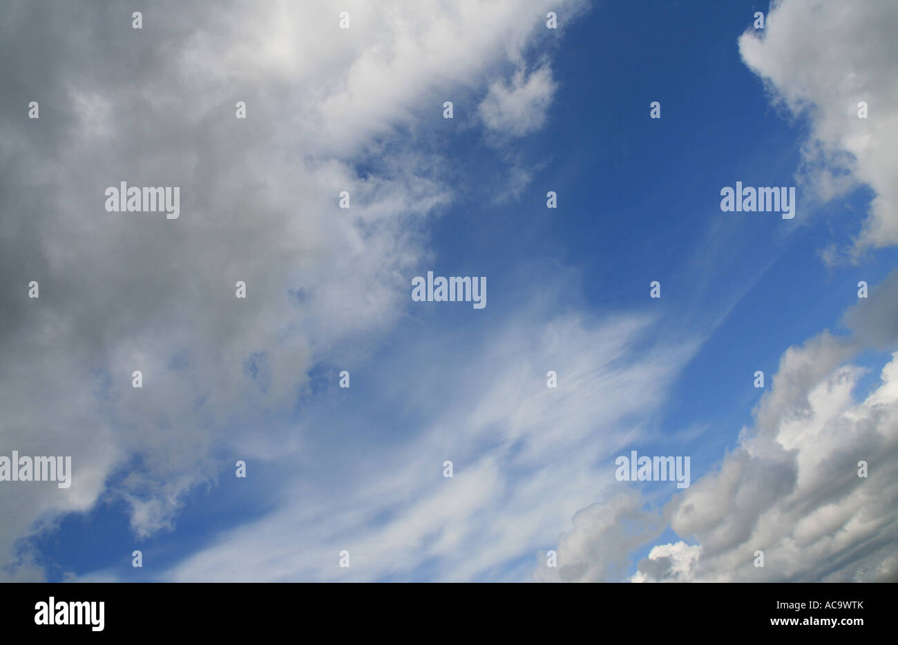 Blue sky and clouds at an angle Stock Photo - Alamy
