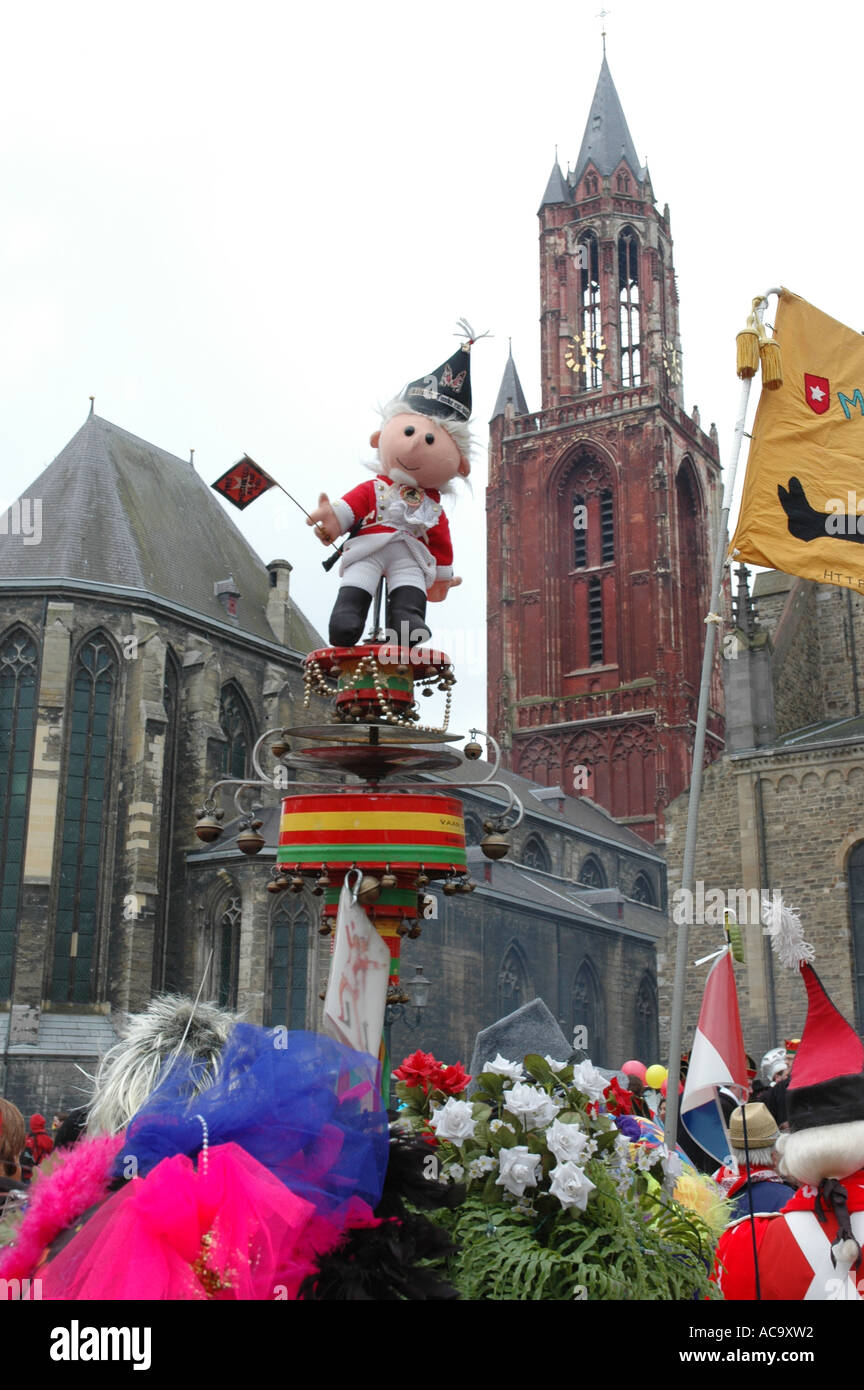Carnival crowd at Vrijthof square with Red Tower of Protestant St Johns ...