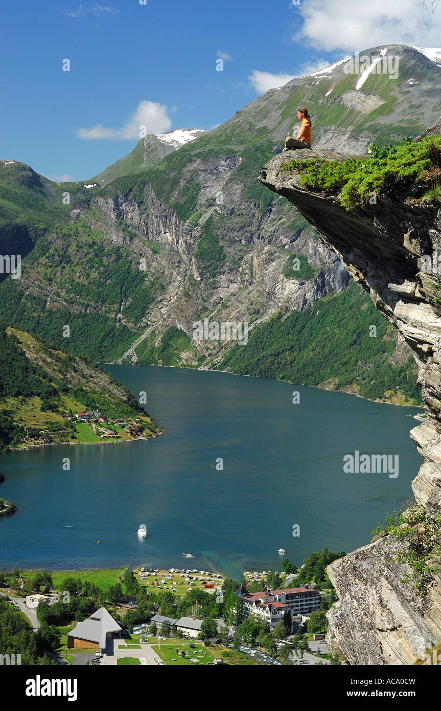 Woman sitting on a ledge, Geiranger Fjord, Hellesylt, More og Romsdal ...