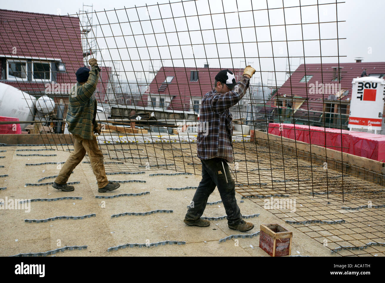Rebar workers installing reinforcing mat for an apartment house, Essen ...
