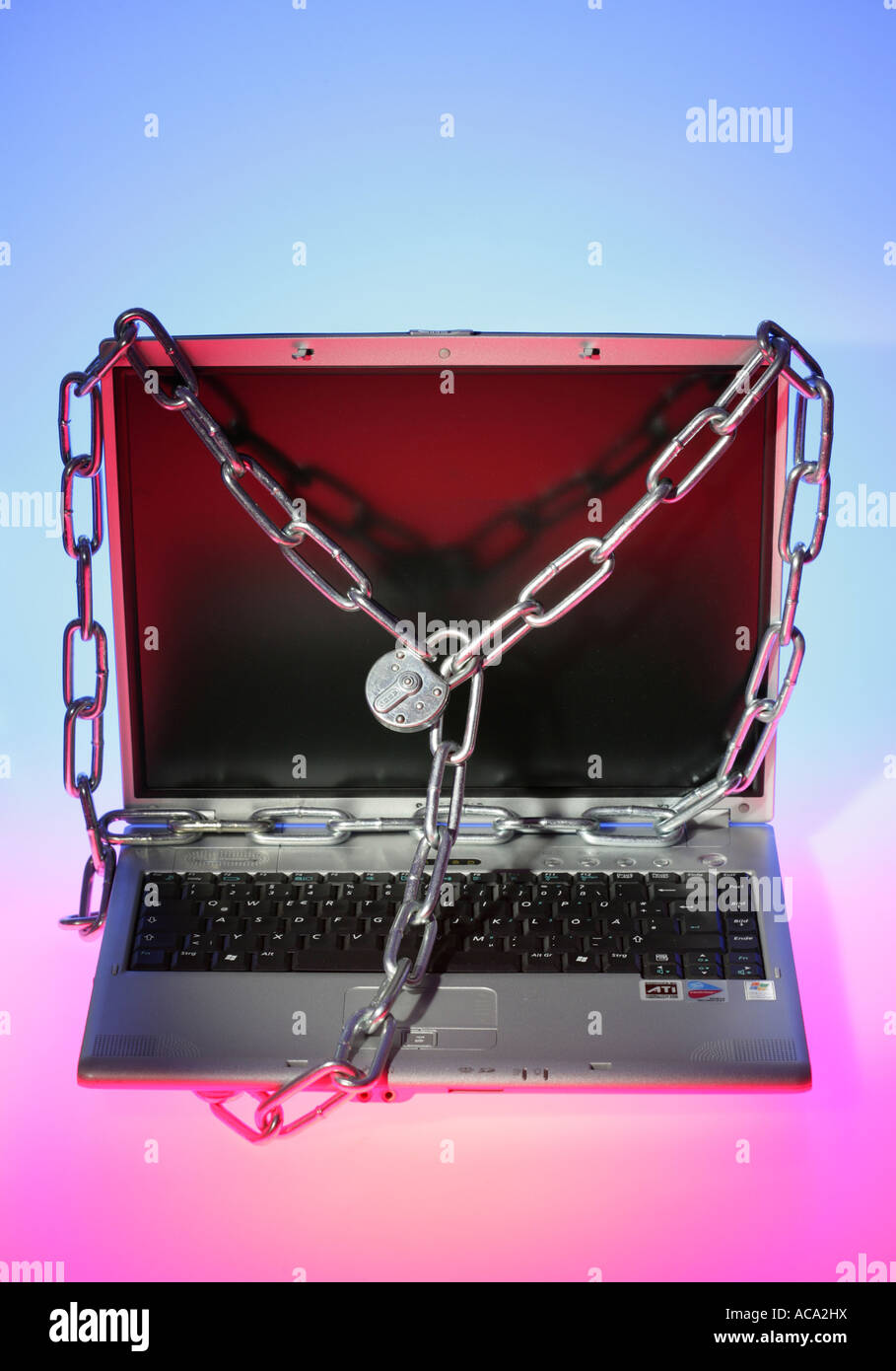 Symbolic photo, computer safety, Laptop computer with chain and lock ...