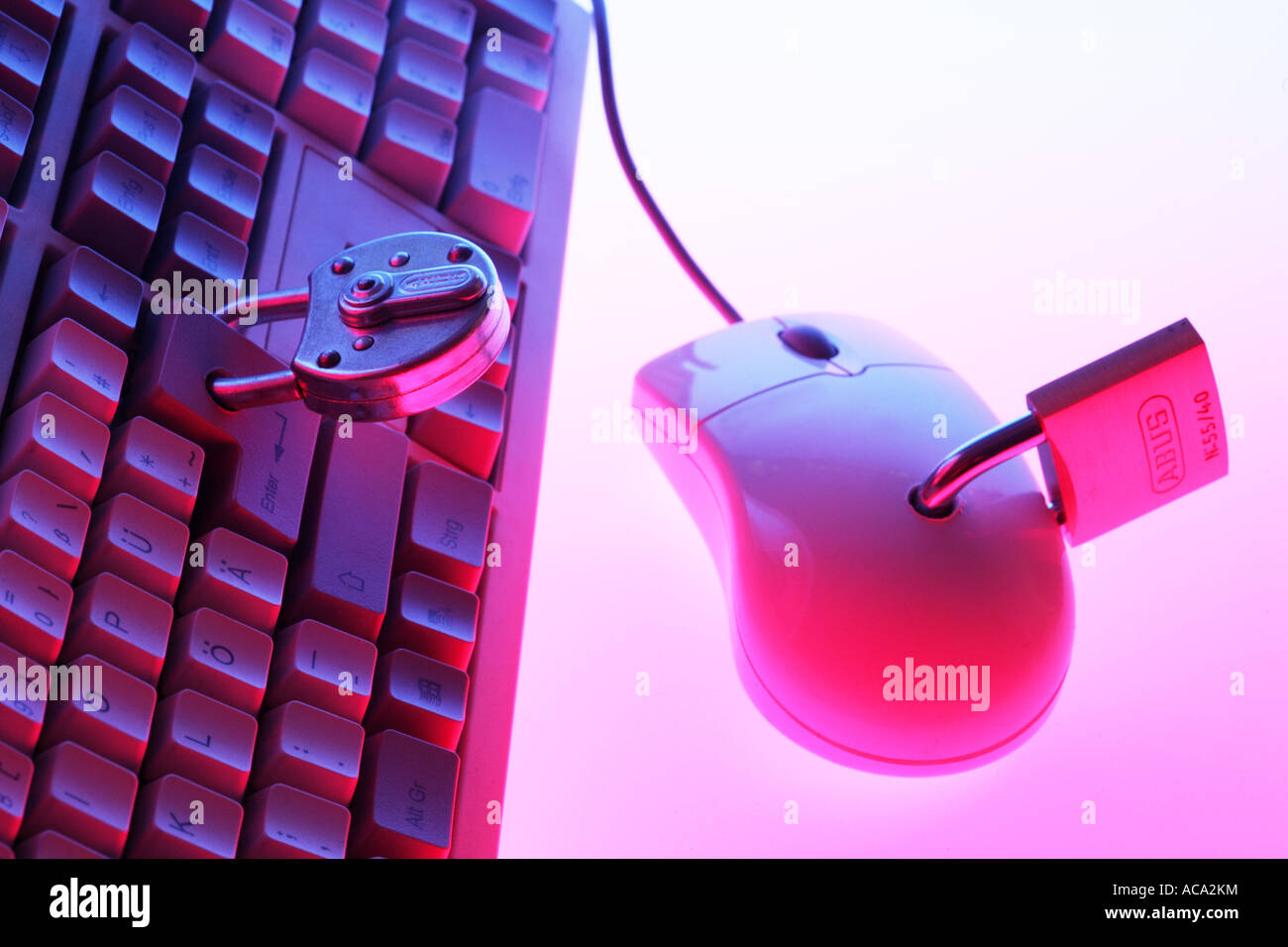 Symbolic photo, computer safety, Computer mouse and keyboard with lock ...