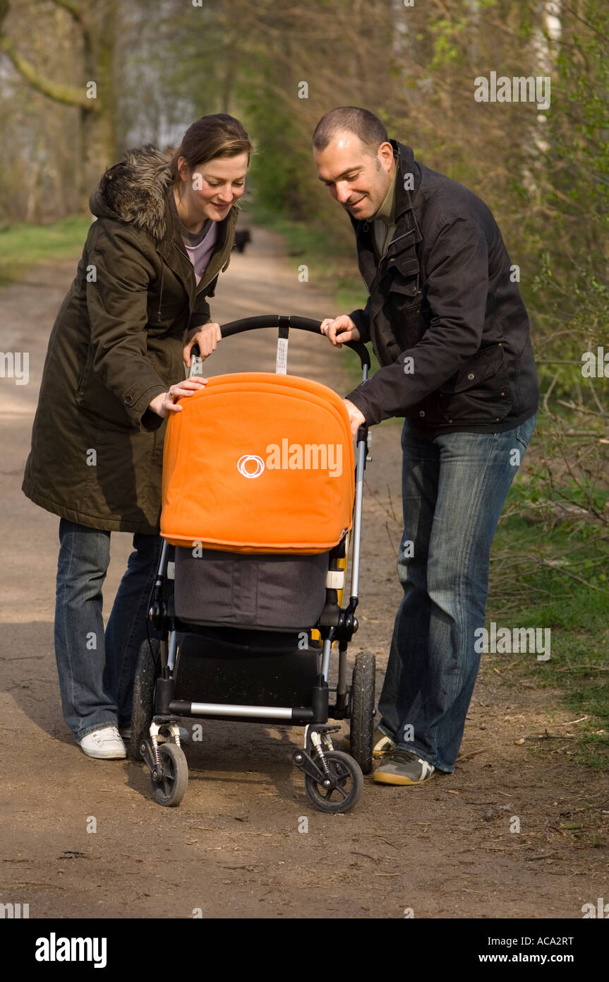 Young family with pram Stock Photo - Alamy
