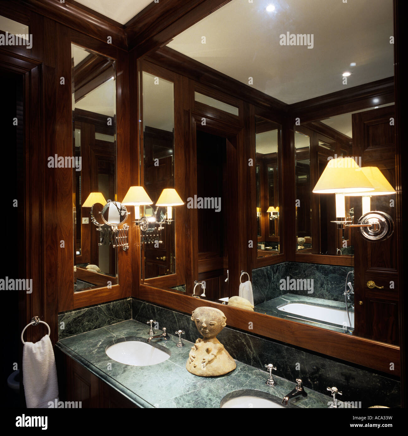 Double basin set in marble unit with wood framed mirror panels Stock ...