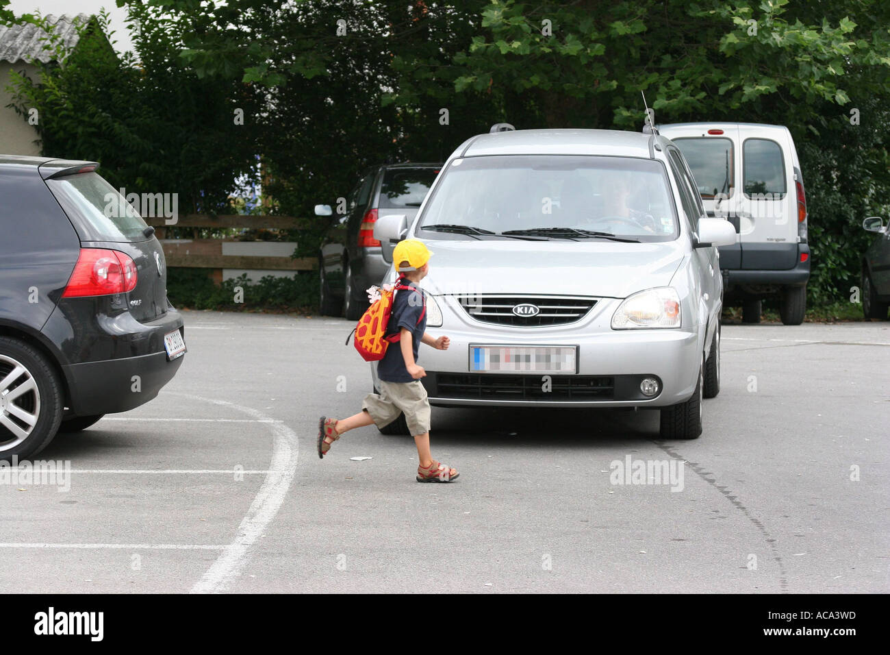 Child running car road danger hi-res stock photography and images - Alamy