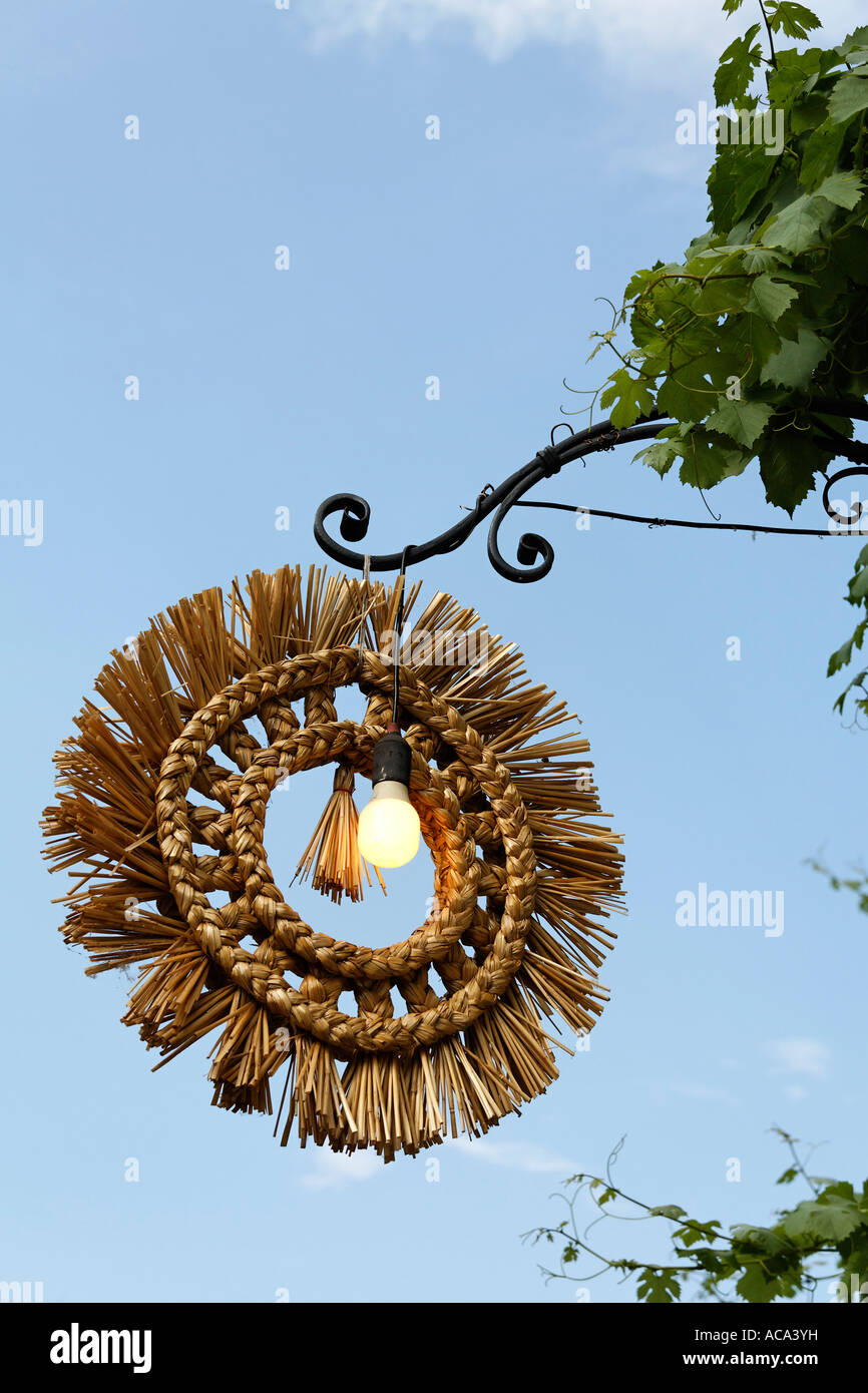 Straw wheel at the entrance of a wine tavern, Duernstein, Wachau, Lower ...