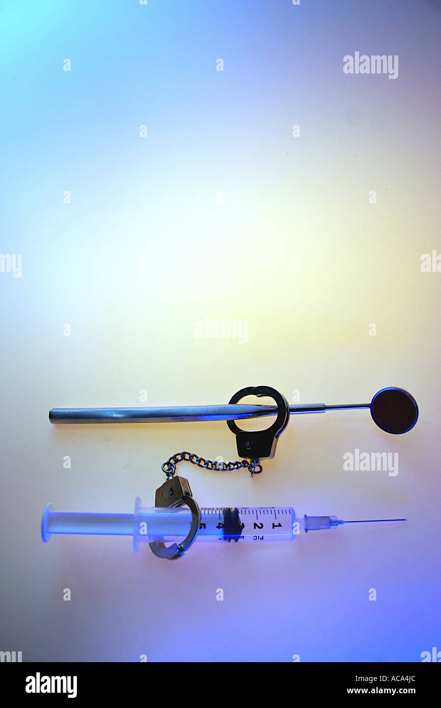 Injection with handcuffs Stock Photo - Alamy