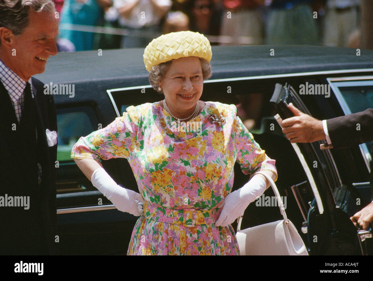 England's Queen Elizabeth-II standing by car smiling Stock Photo - Alamy