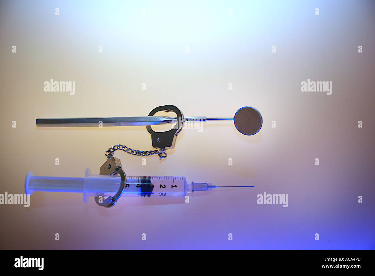 Injection with handcuffs Stock Photo - Alamy