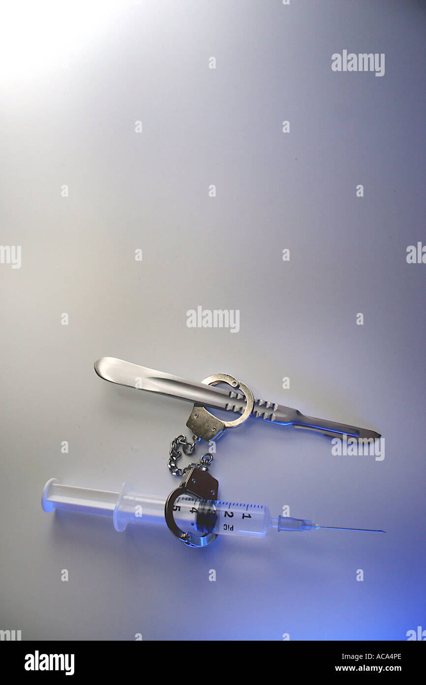 Injection with handcuffs Stock Photo - Alamy