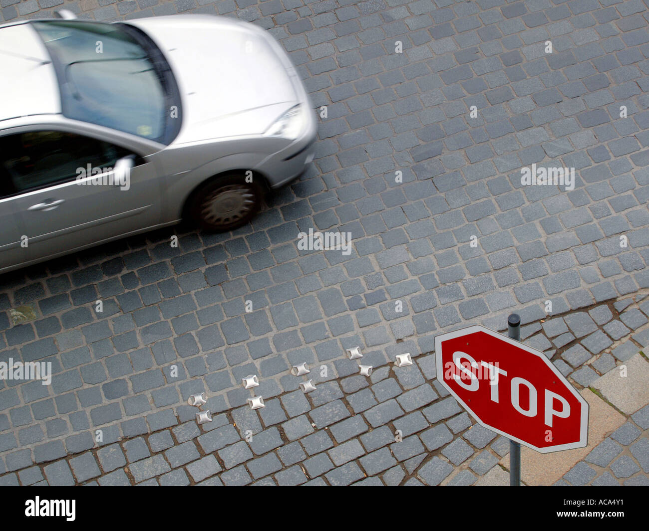 Car in front of stop sign Stock Photo - Alamy
