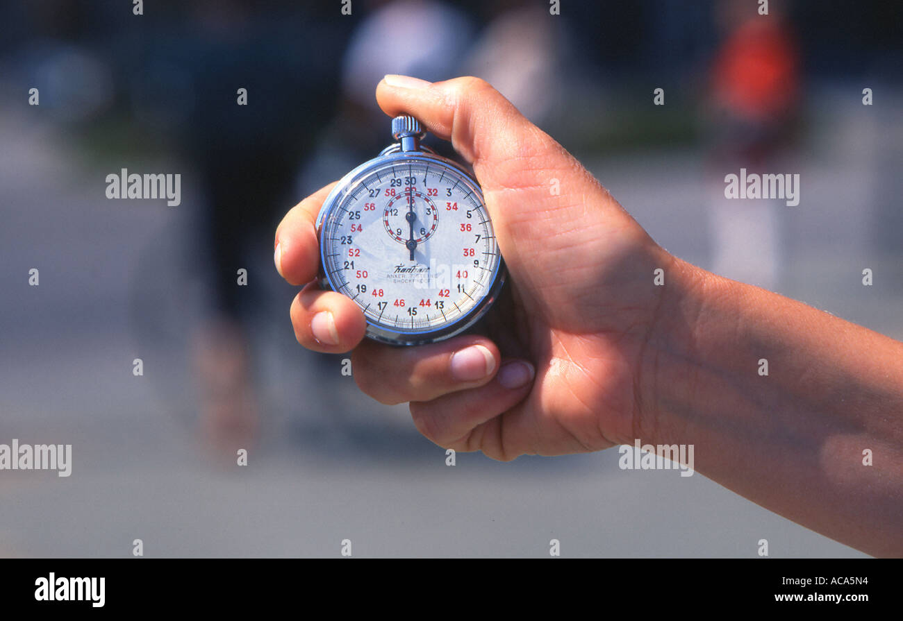 Hand with stopwatch Stock Photo - Alamy