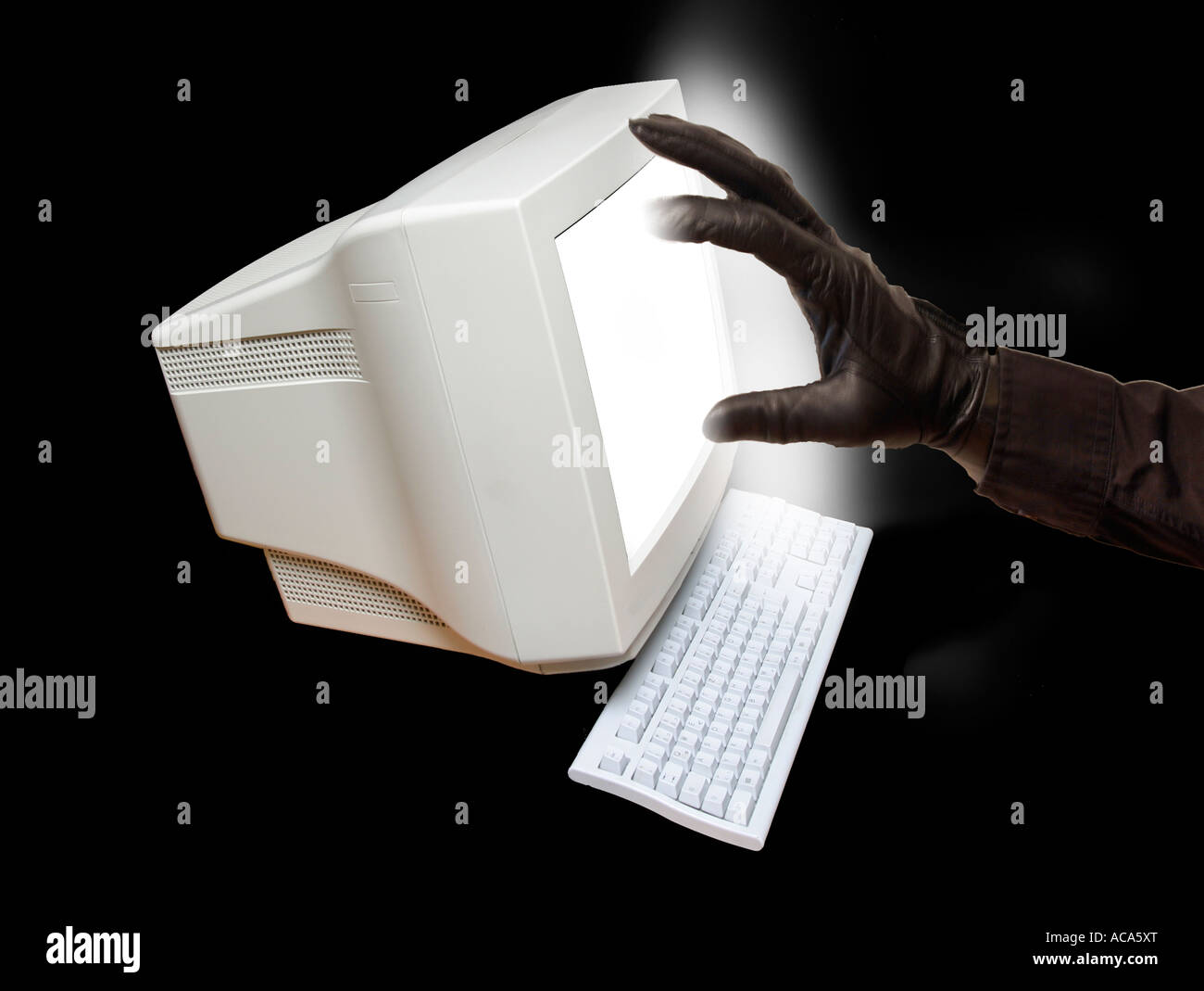 Hand with black glove reaches into a computer Stock Photo - Alamy
