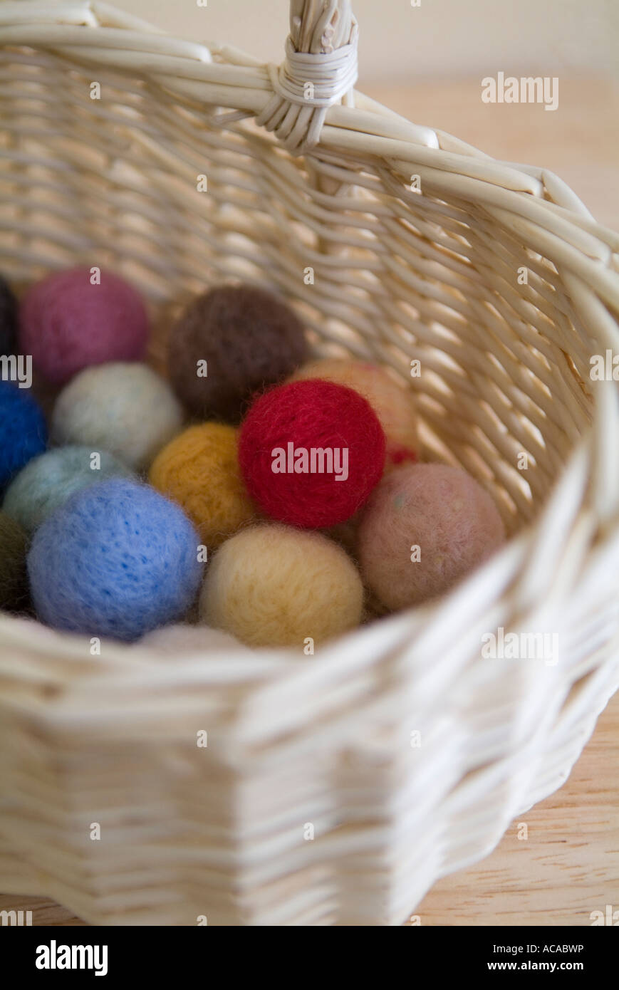 Felt balls in basket Stock Photo - Alamy
