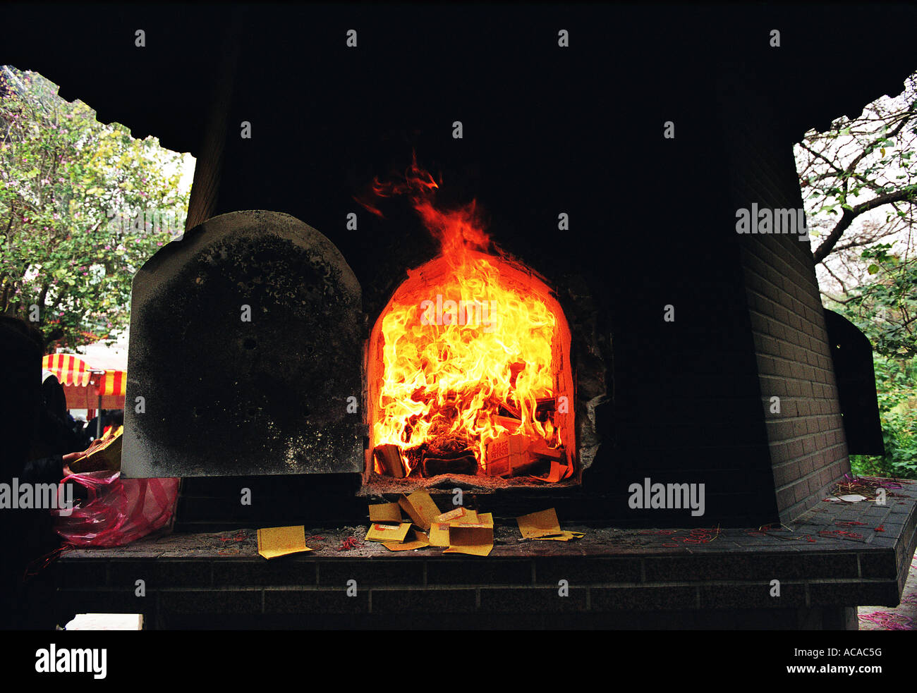 Burning money for ancestors Stock Photo - Alamy